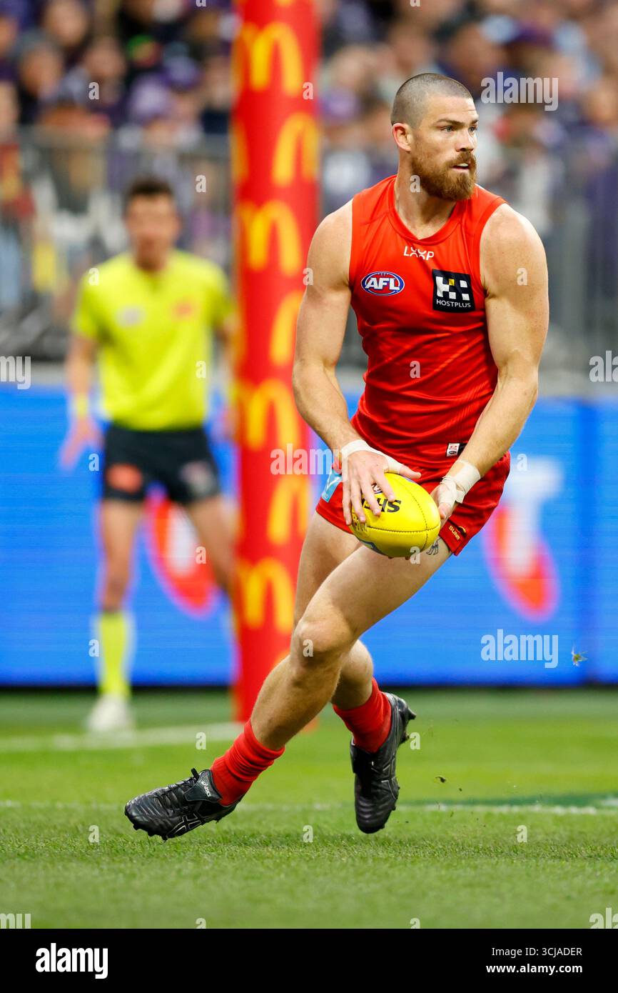 Sam Collins of the Suns looks to dispose the ball during the AFL ...