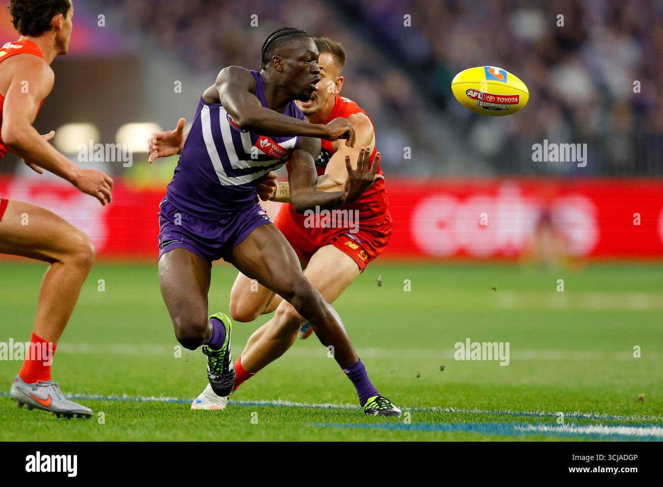 Michael Frederick of the Dockers handballs away during the AFL ...