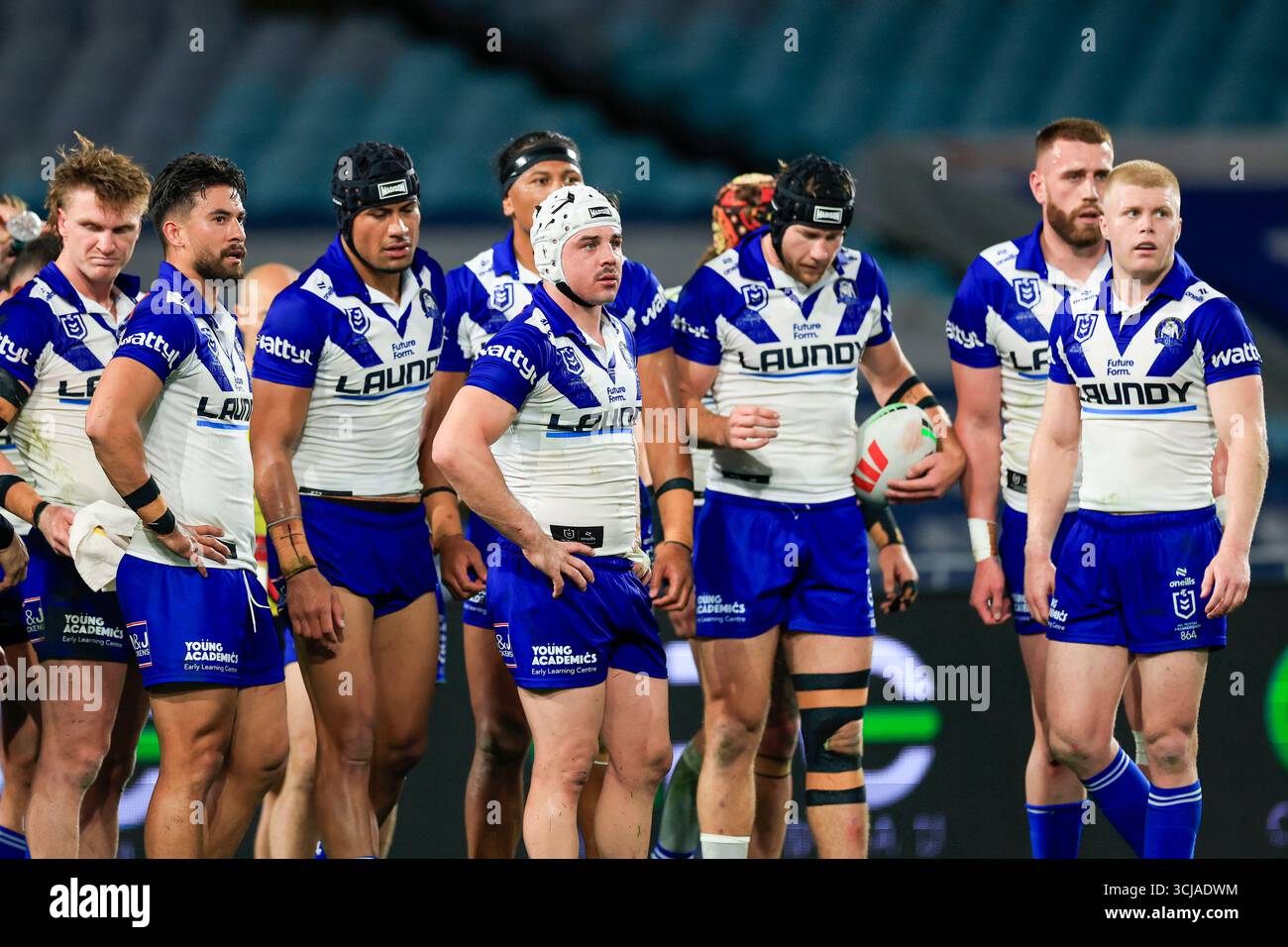 Bulldogs players look on as Sharks convert during the NRL Round 27 ...