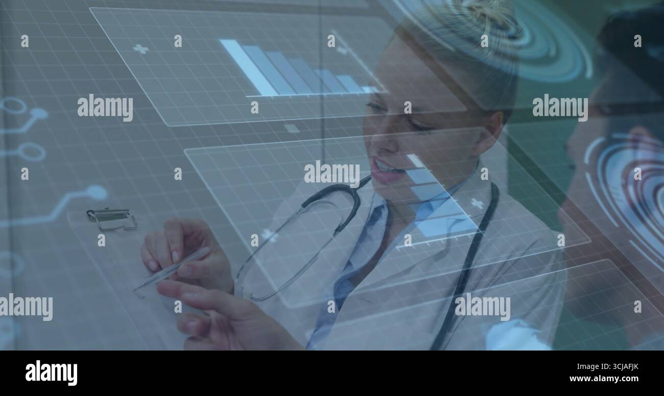 Doctor reviewing chart and handing pen to patient in clinic, with ...