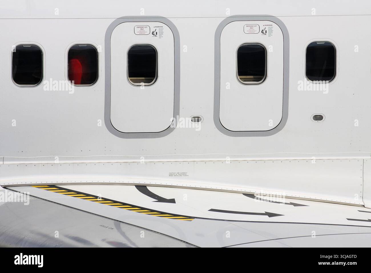 overwing emergency exits of an airliner Stock Photo - Alamy