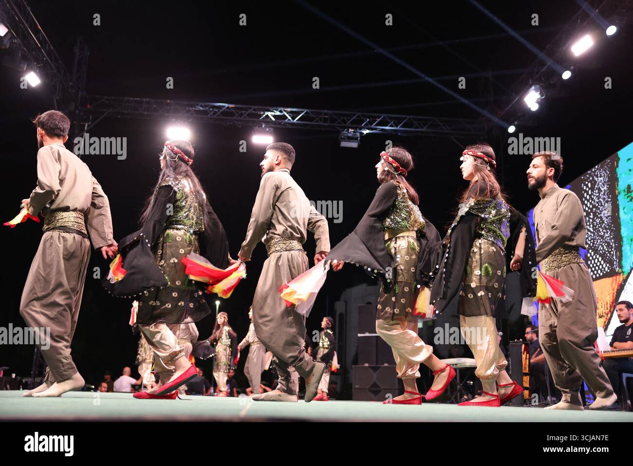 A Kurdish traditional dance troupe performs during the Damascus ...