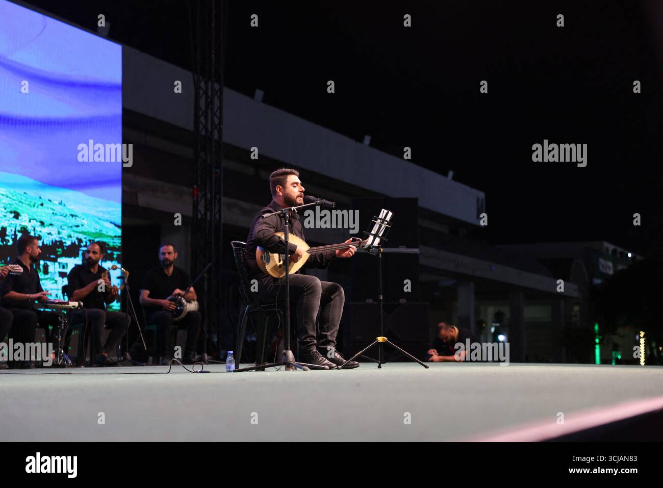 A Kurdish music group performs on stage during the Damascus ...