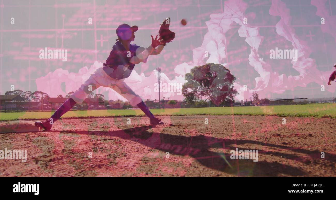 Lunging ballplayer in cap scooping ground ball on baseball field, with ...