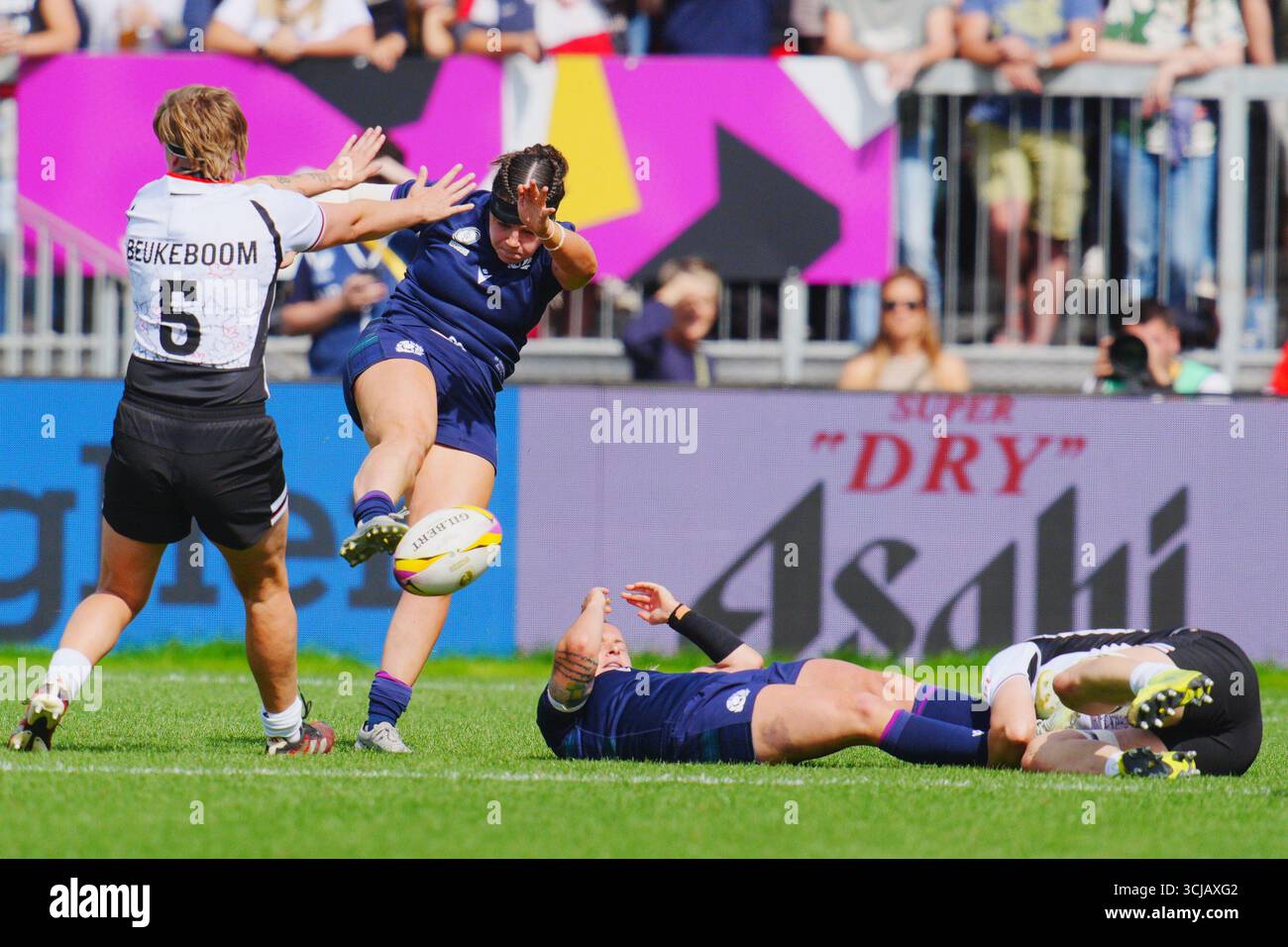 Scotland's Lisa Thomson kicks the ball as Canada's Tyson Beukeboom ...