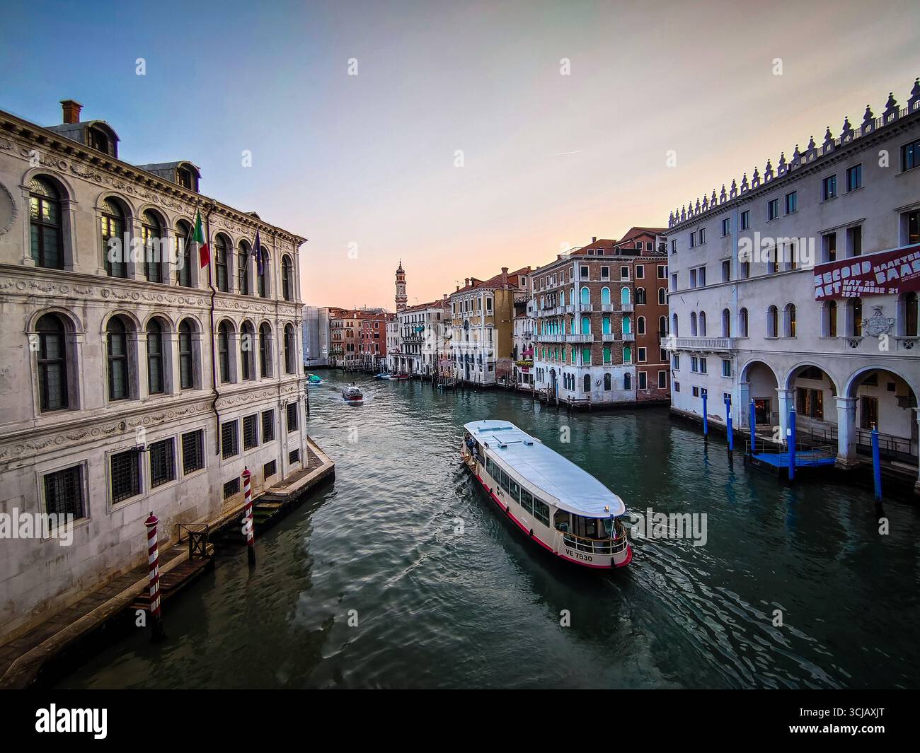 A serene twilight scene on the Grand Canal in Venice, Italy. The image ...
