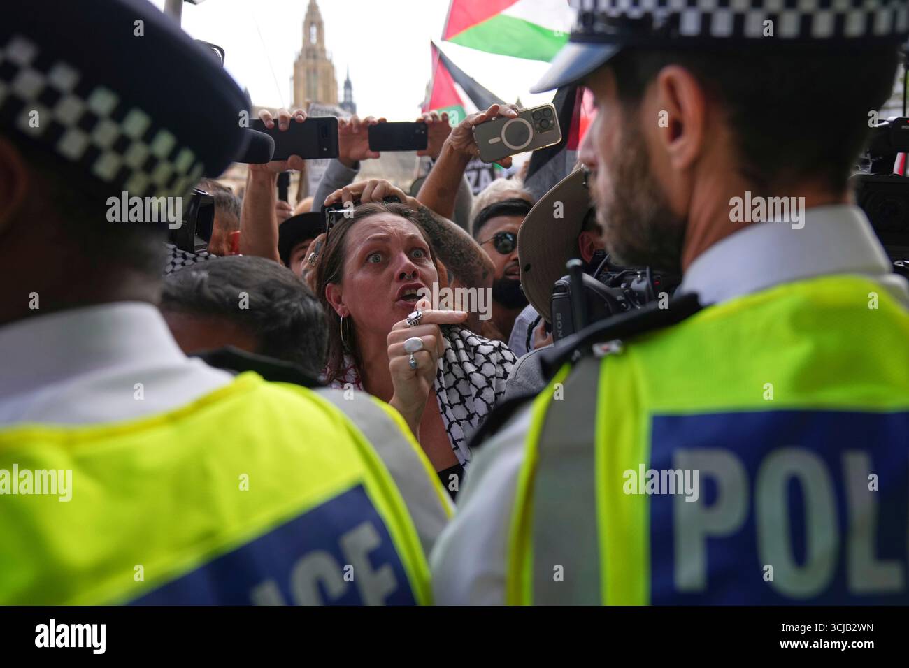 Protesters argue with police officers during a protest to support ...