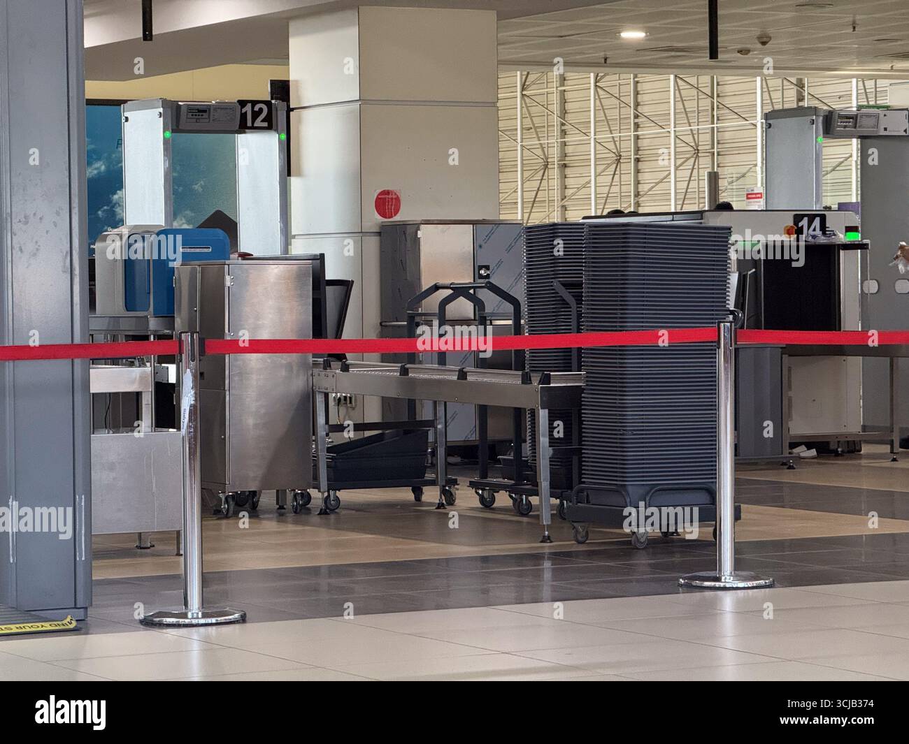 Airport security checkpoint with scanning machines and gates. Safety ...