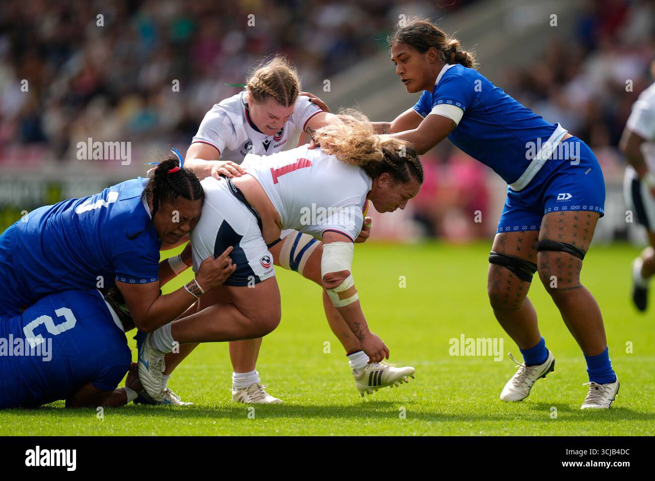 USA's Hope Rogers (centre) is tackled during the Women's Rugby World ...