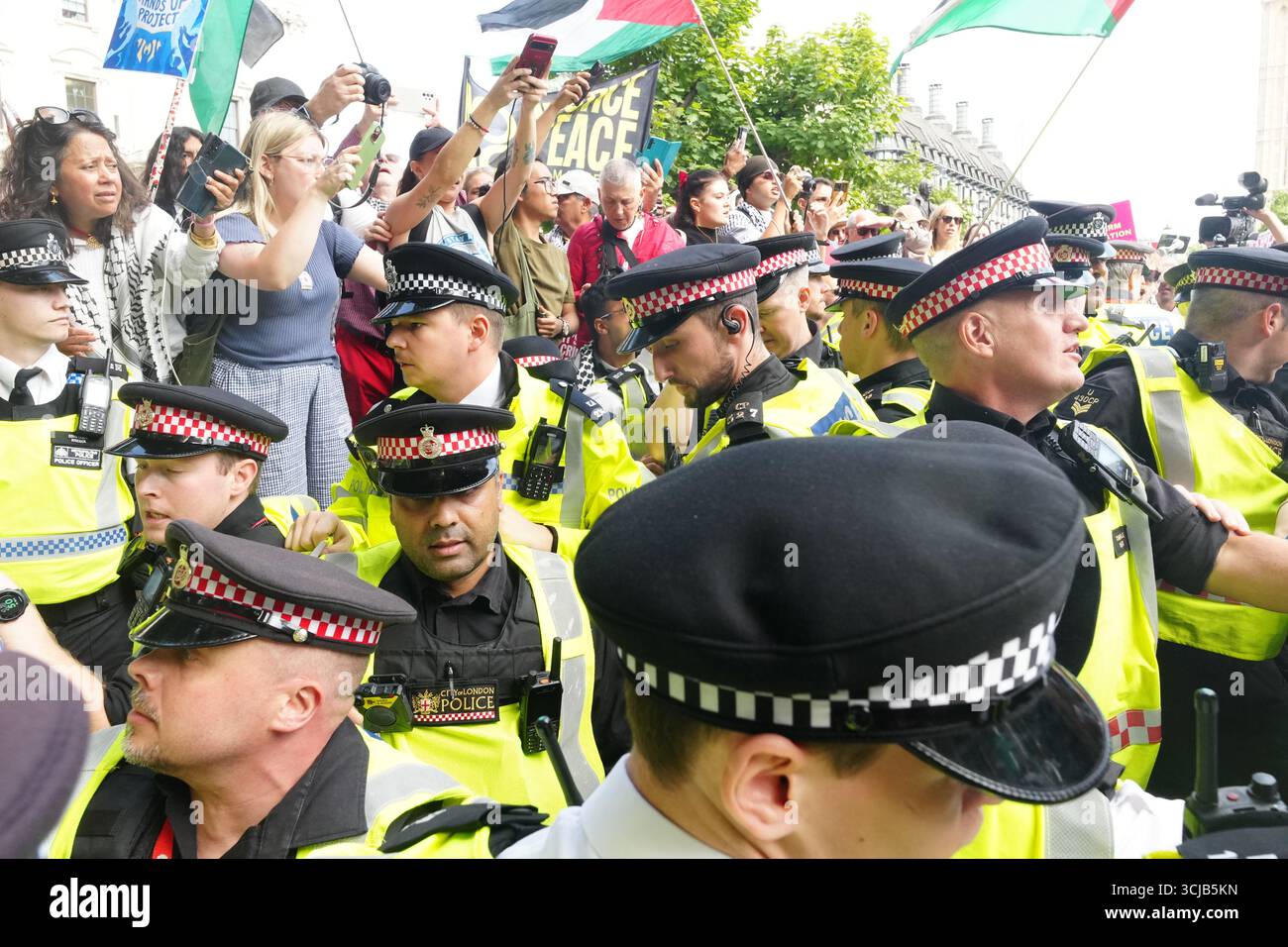 Police officers with demonstrators as people take part in a Lift the ...