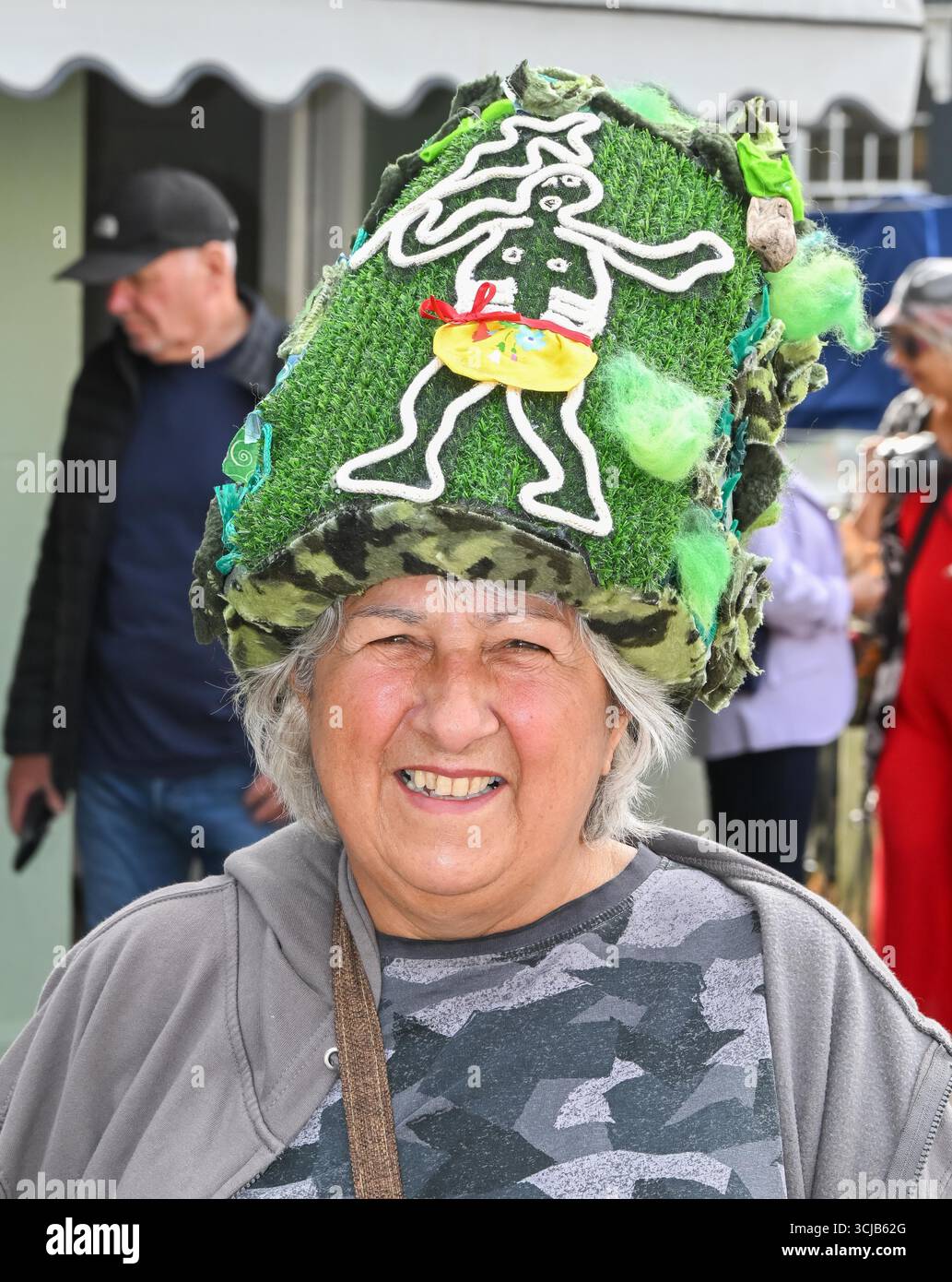 Bridport, Dorset, UK. 6th September 2025. A woman wearing a hat ...