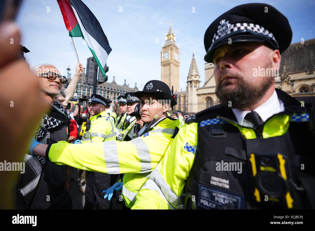 Police officers with demonstrators as people take part in a Lift the ...
