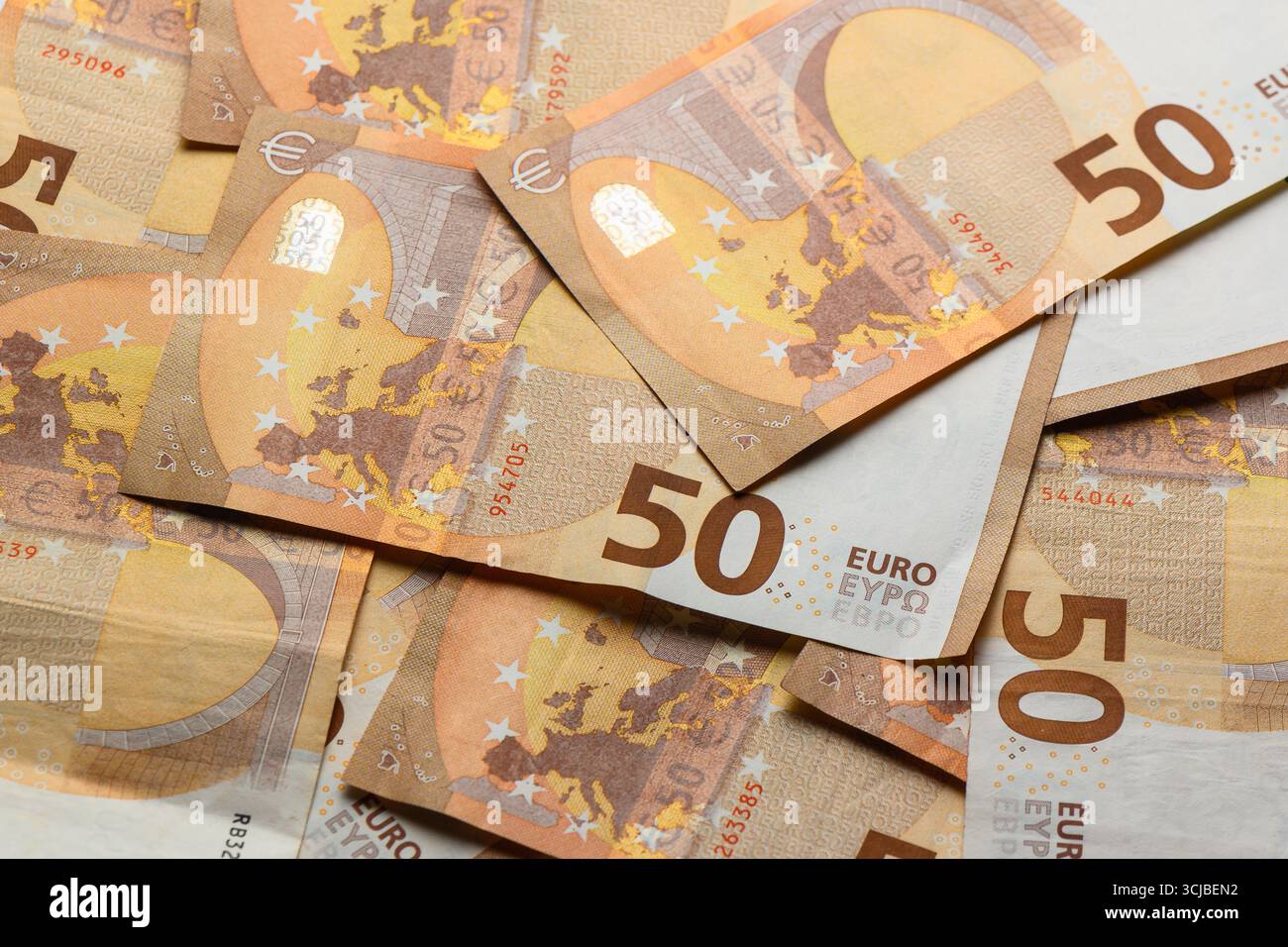 Fifty euro banknotes in close-up view, showing details of security ...
