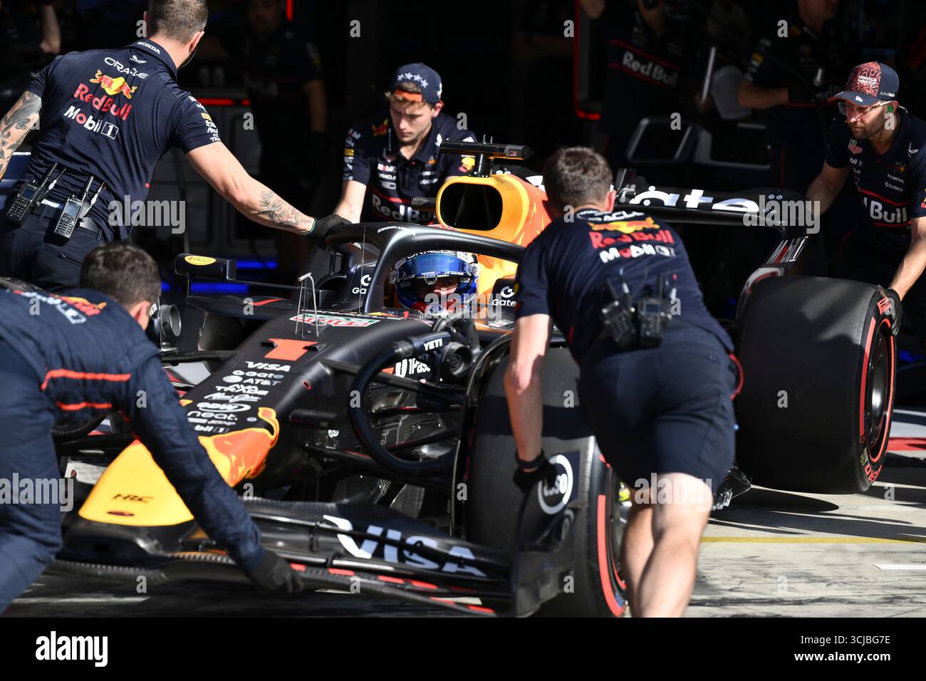 Red Bull driver Max Verstappen of the Netherlands gets pushed back into ...