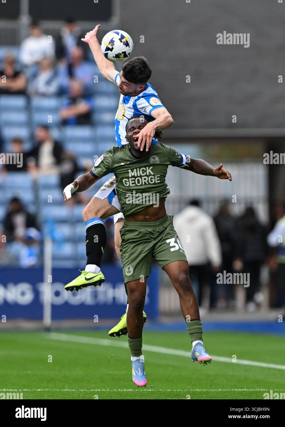 Huddersfield Town's Sean Roughan and Peterborough United's Peter Kioso ...