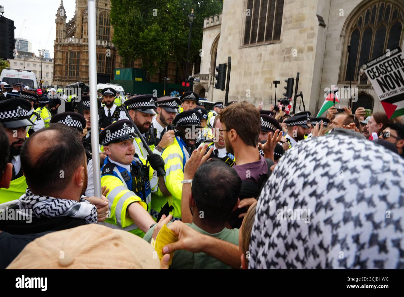 Police officers with demonstrators as people take part in a Lift the ...