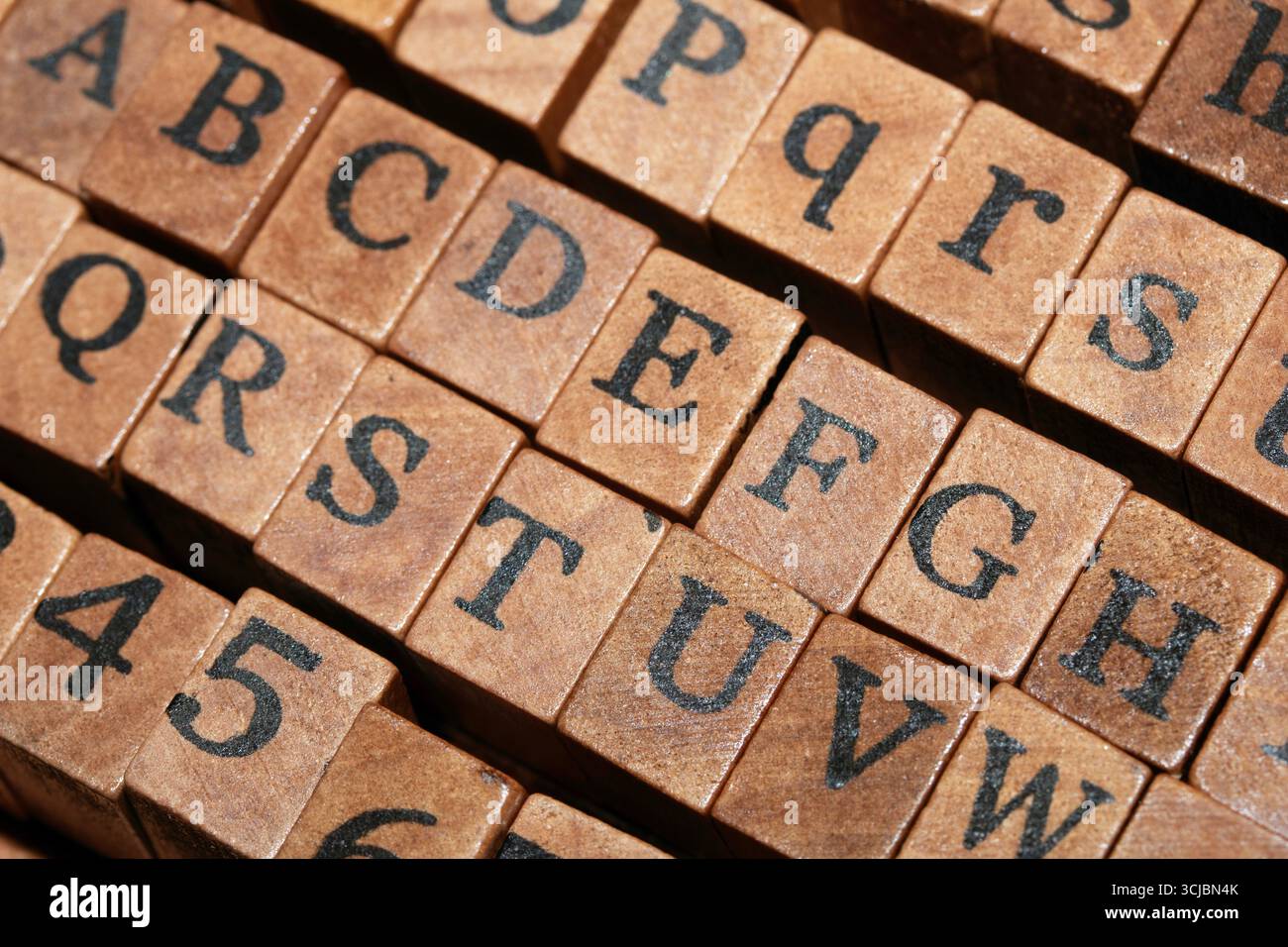 Jumbled up block wood print letters lined up Stock Photo - Alamy