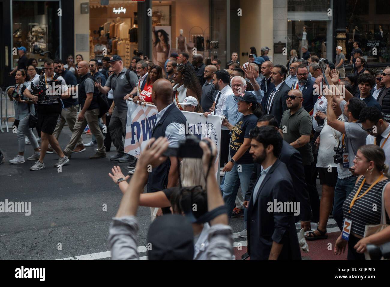 Senator Bernie Sanders waves at the crowd while walking in the Labor ...