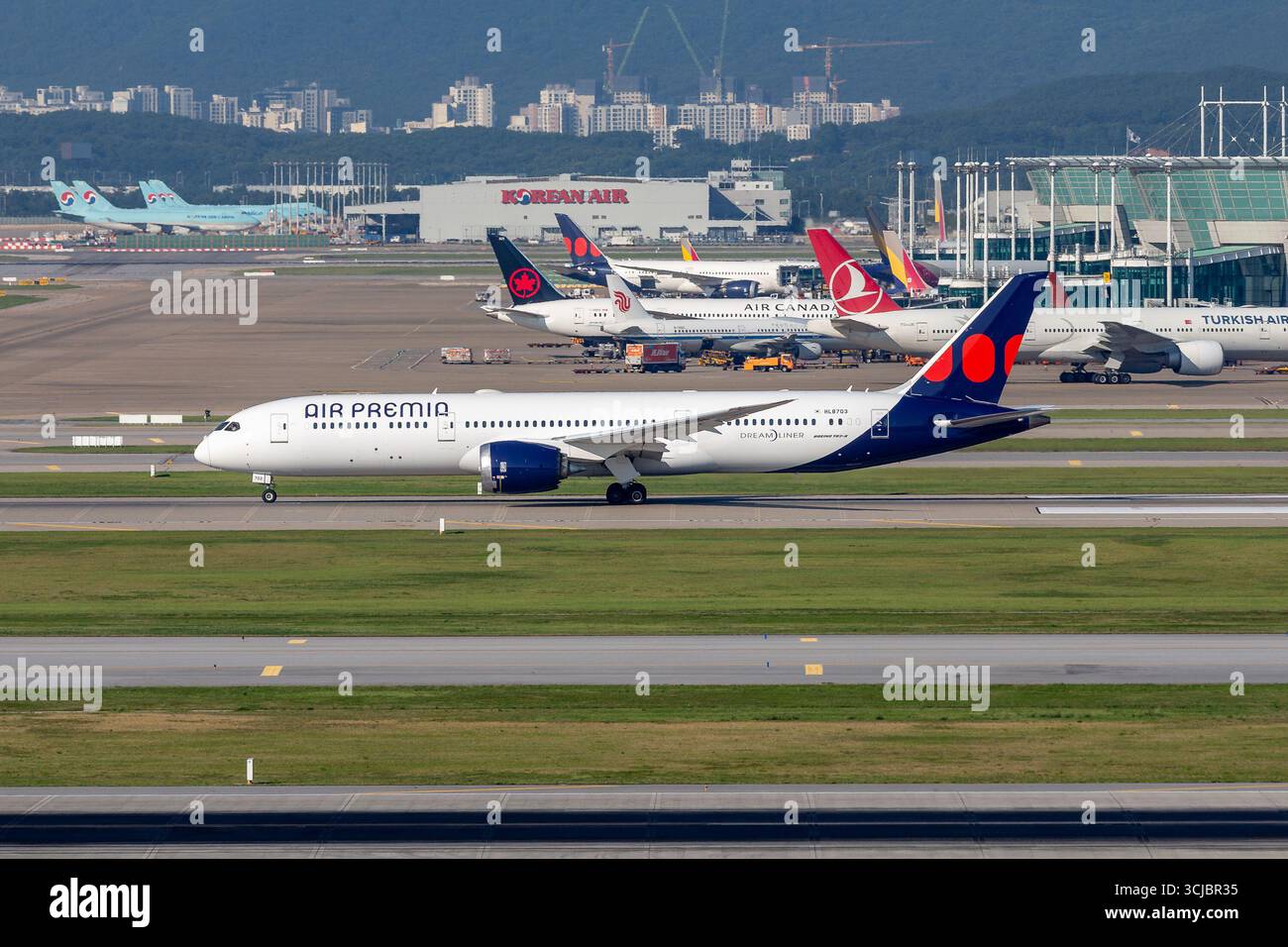 This photograph captures an Air Premia Boeing 787-9 Dreamliner ...