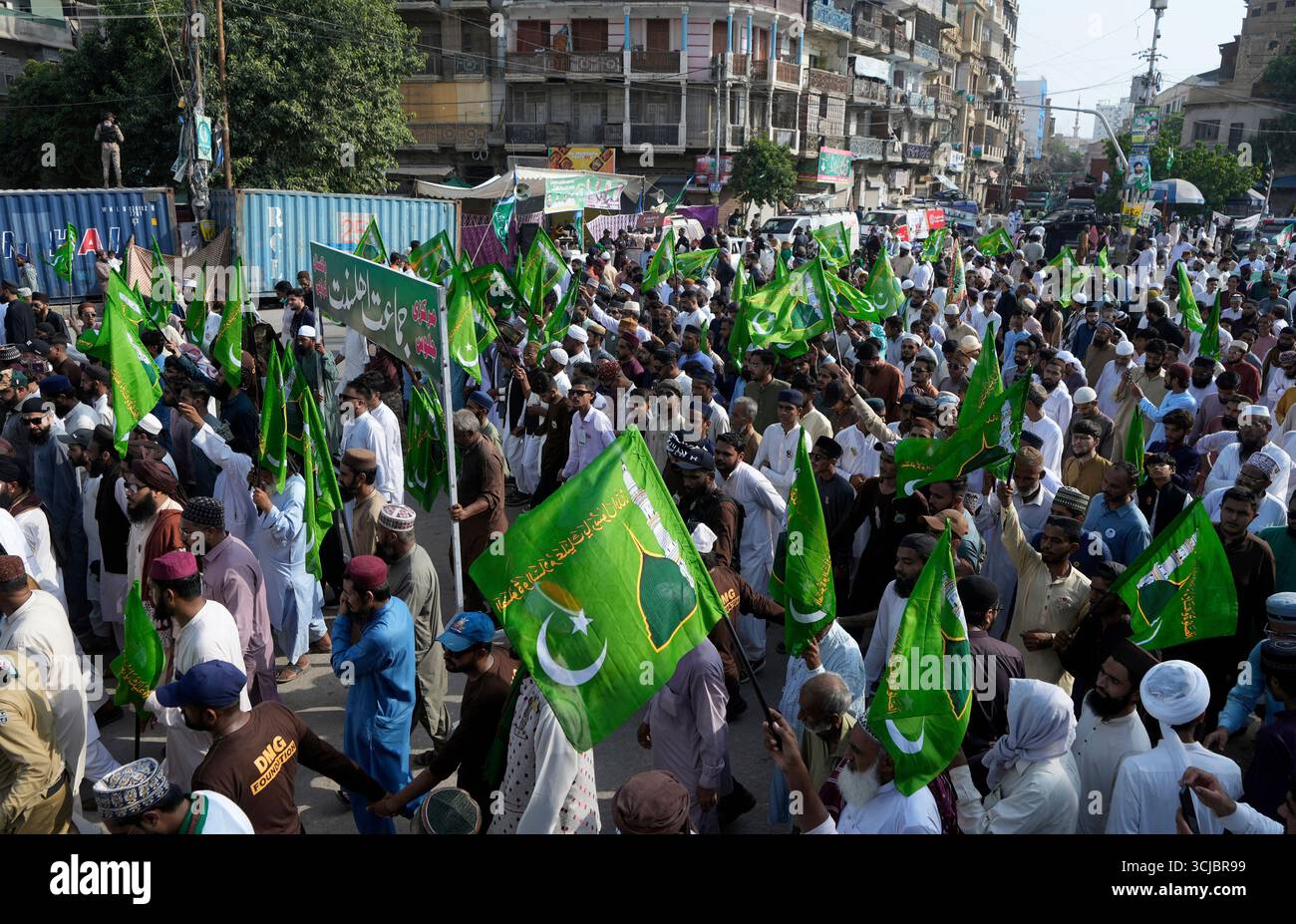 Muslims attend a procession as they mark Prophet Muhammad's birthday ...