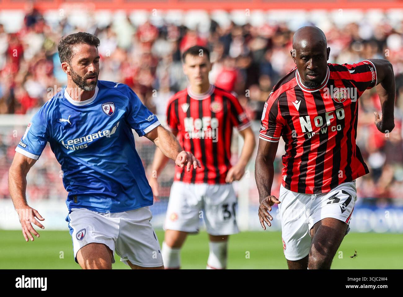 Chesterfield's Will Grigg & Walsall's Albert Adomah race after the ball ...