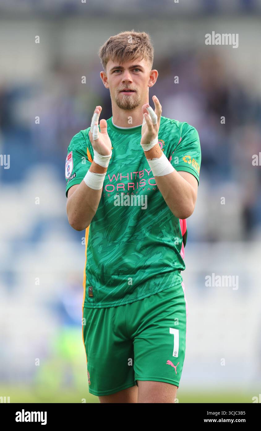 Crewe Alexandra's Tom Booth acknowledges the crowd at the final whistle ...