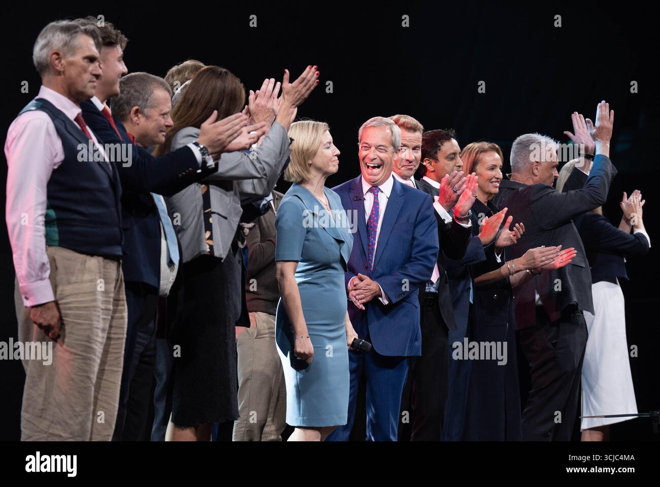 Reform UK leader Nigel Farage is joined by Reform MPs and members on ...