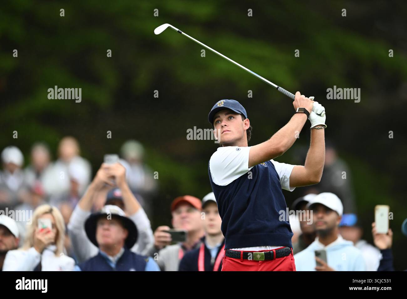 The USA team's Jackson Koivun hits from the third tee during Walker Cup golf matches against the ...