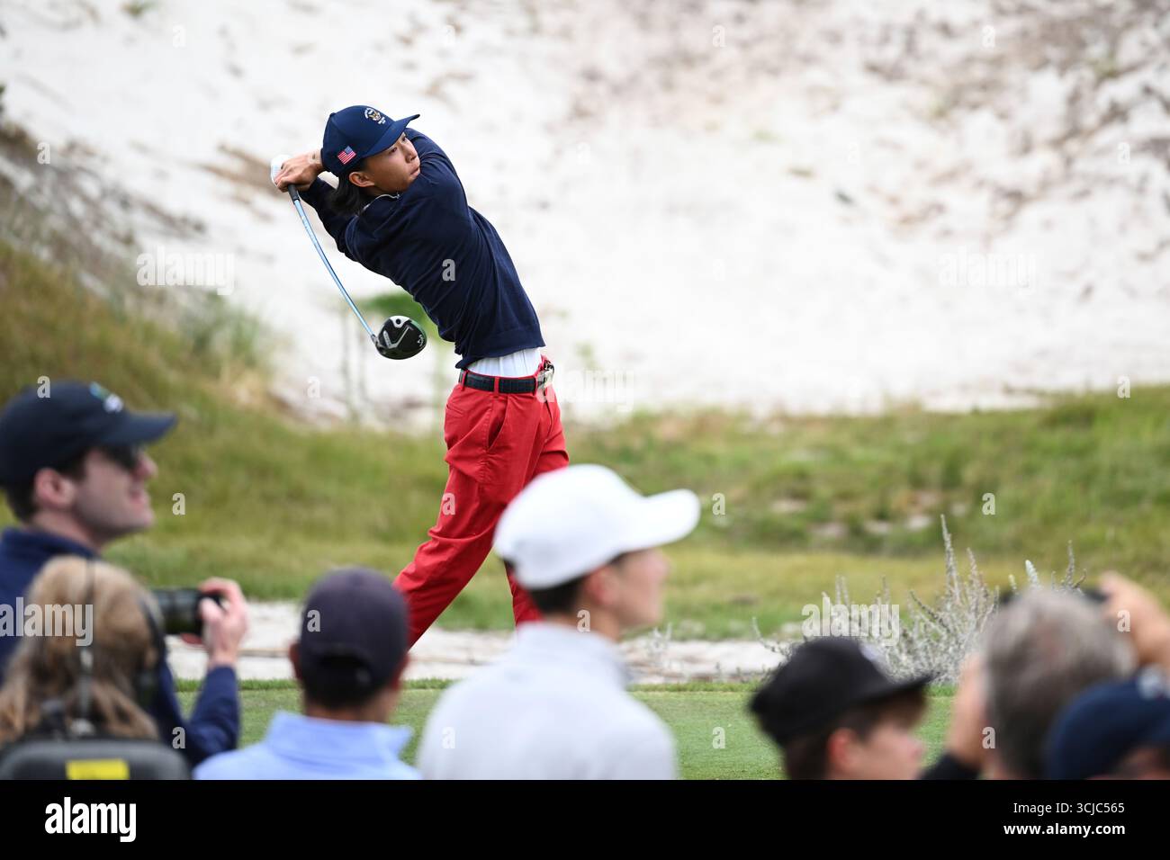 The USA team's Ethan Fang hits from the fourth tee during Walker Cup ...