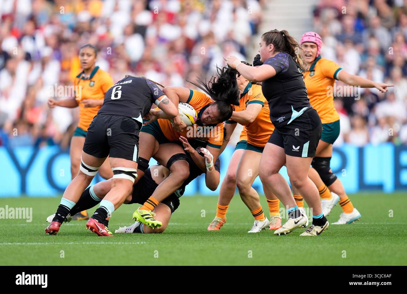 Australia's Siokapesi Palu is tackled by England's Morwenna Talling ...