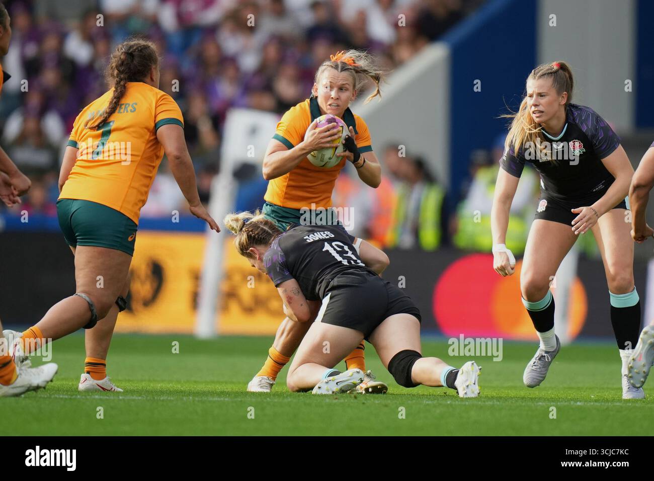 Australia's Georgina Friedrichs, top, and England's Megan Jones ...