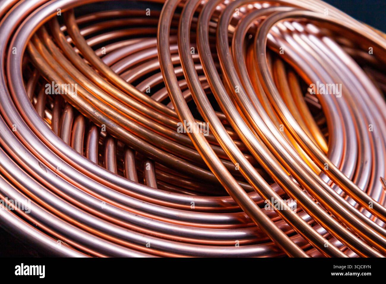 New copper twisted pipes of the same diameter Stock Photo - Alamy