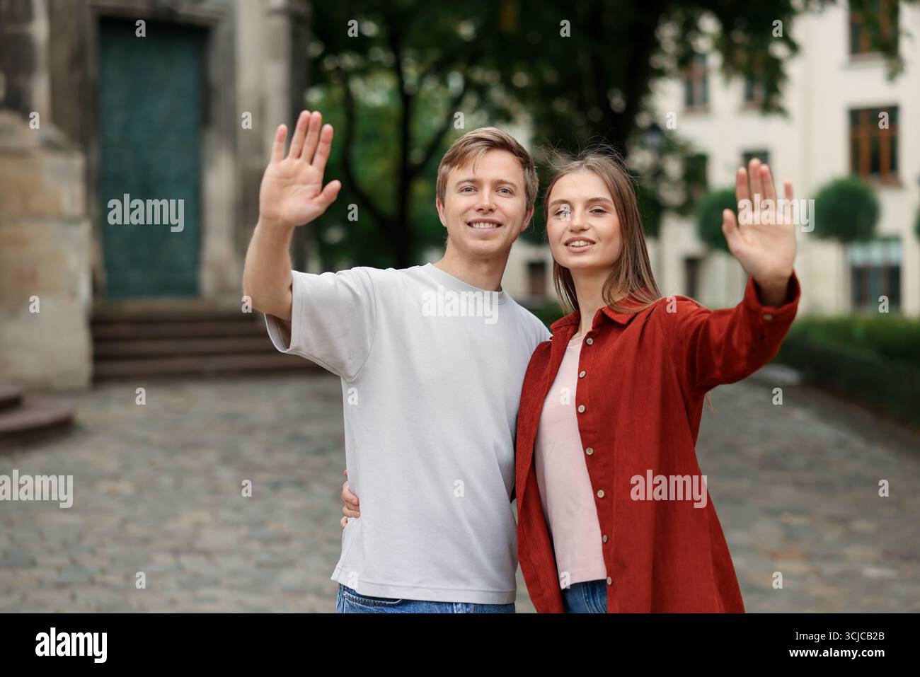 Goodbye lovely couple waving hi-res stock photography and images - Alamy