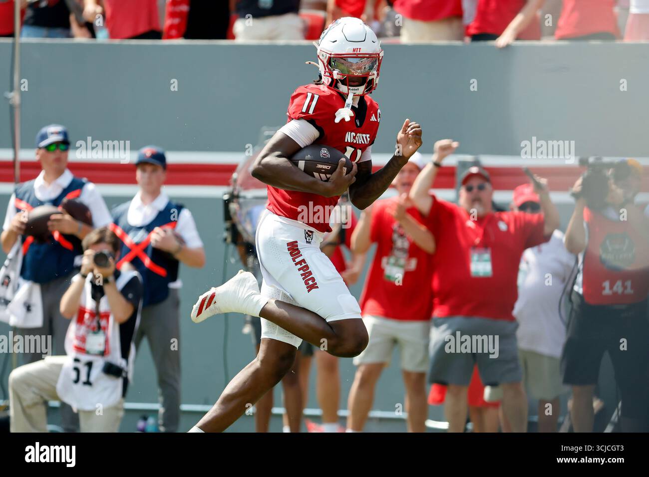 North Carolina State's CJ Bailey (11) scores a touchdown against ...