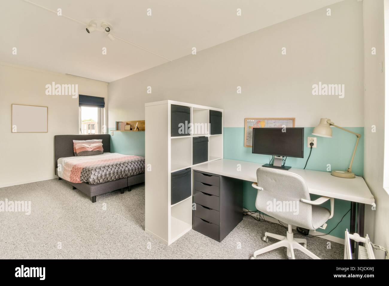 A stylish modern bedroom featuring a comfortable bed, a workspace with ...