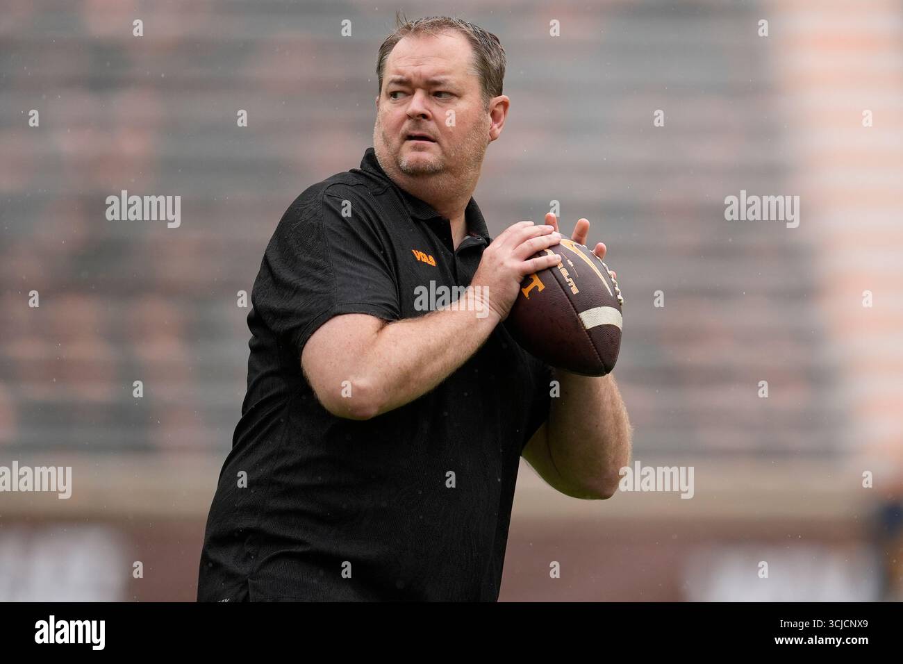 Tennessee head coach Josh Heupel looks to throw a pass before an NCAA ...
