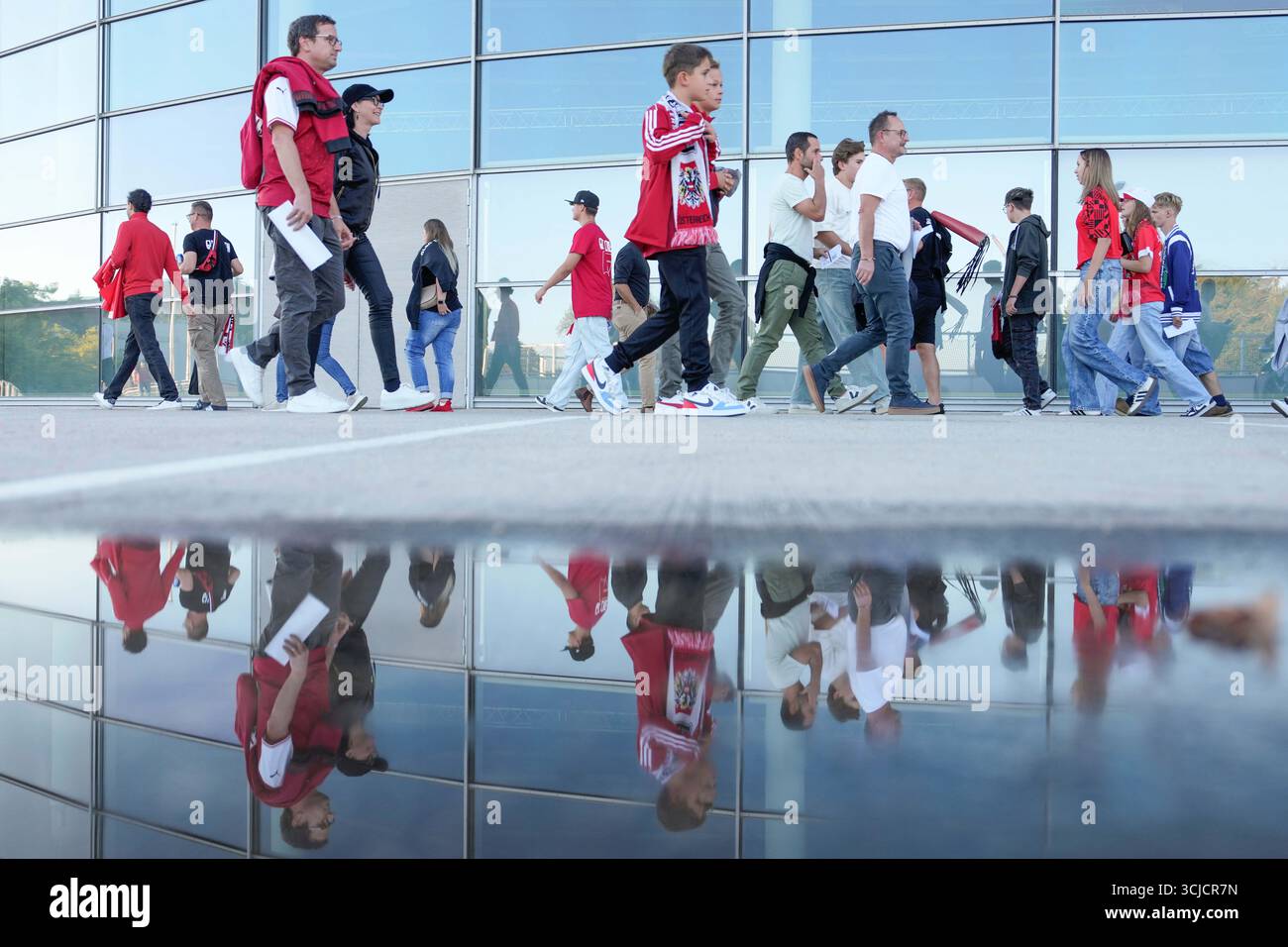 LINZ, AUSTRIA - SEPTEMBER 6: Fans on the way to the stadium during the ...