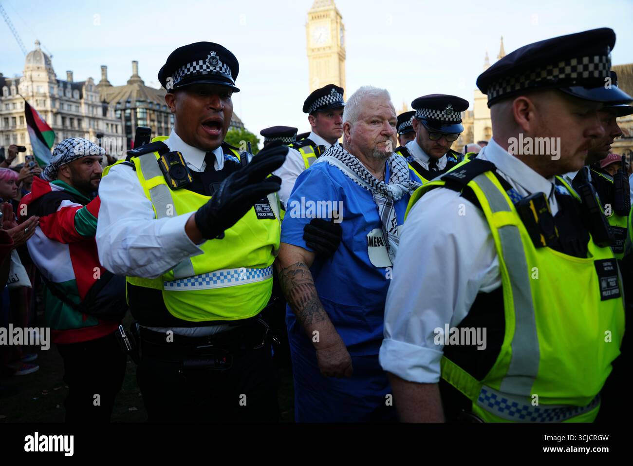 Police officers remove a protester as demonstrators take part in a Lift ...