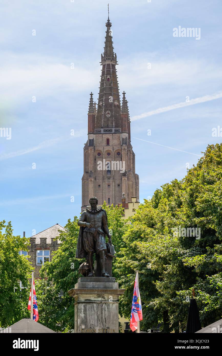 The Statue of mathematician Simon Stevin and Church of Our Lady Roman ...