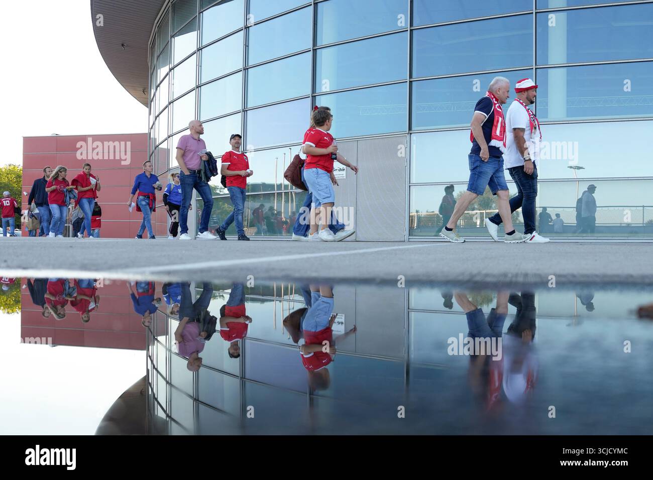 LINZ, AUSTRIA - SEPTEMBER 6: Fans on the way to the stadium during the ...