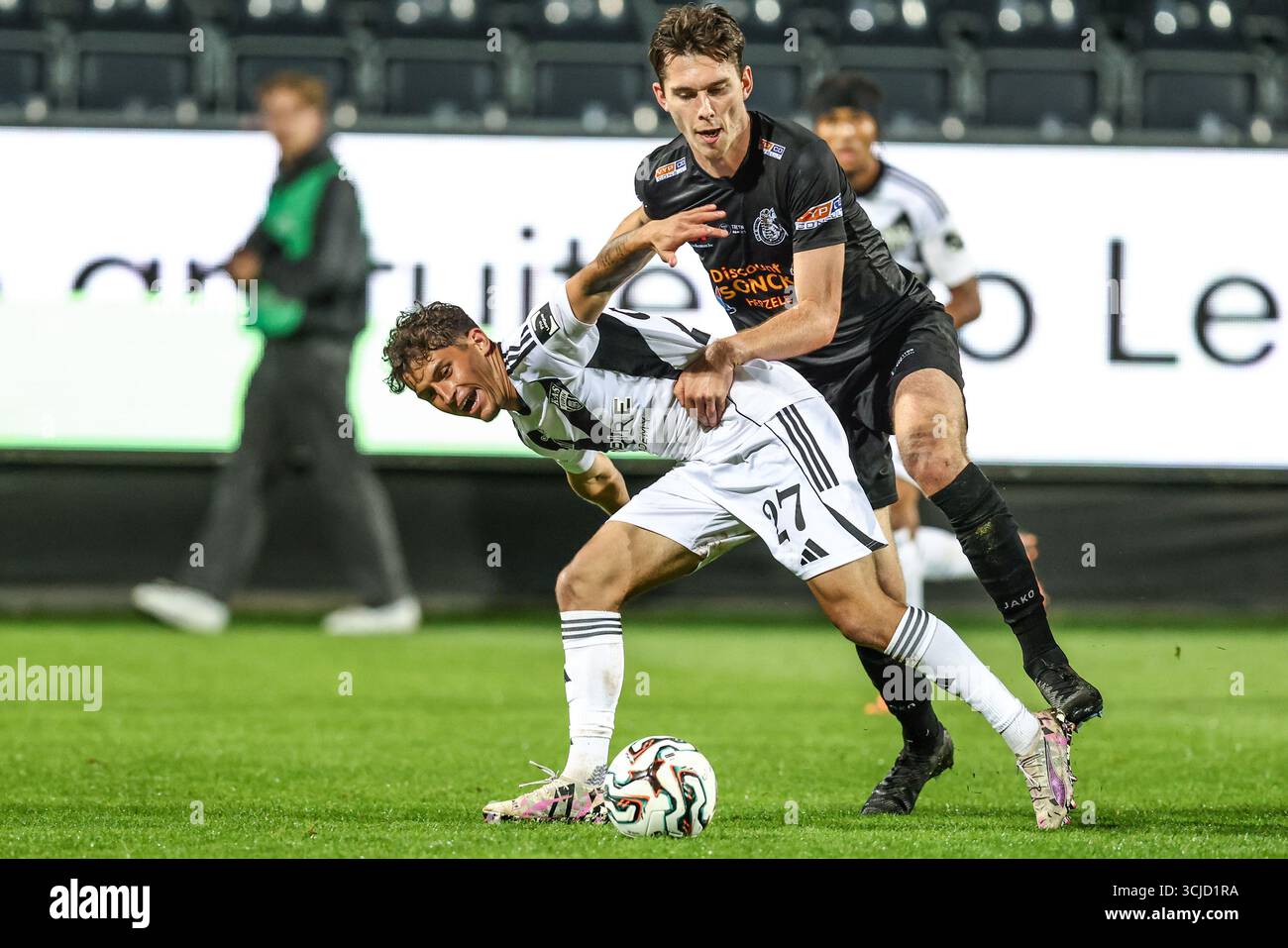 Eupen's Mark Muller and Borsbeke's Lucas Coppens fight for the ball ...