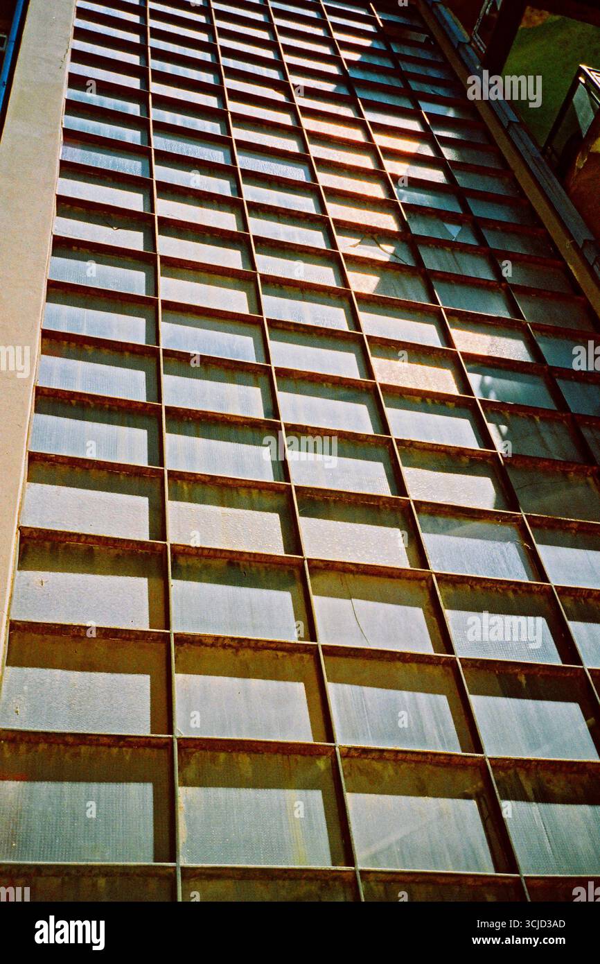 Sunlit interior courtyard (lightwell) of a 1960s residential building ...