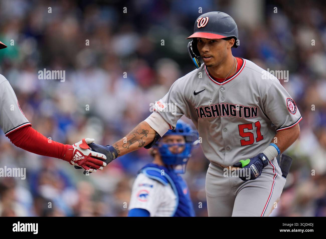Washington Nationals' Daylen Lile (51) celebrates after hitting a home ...