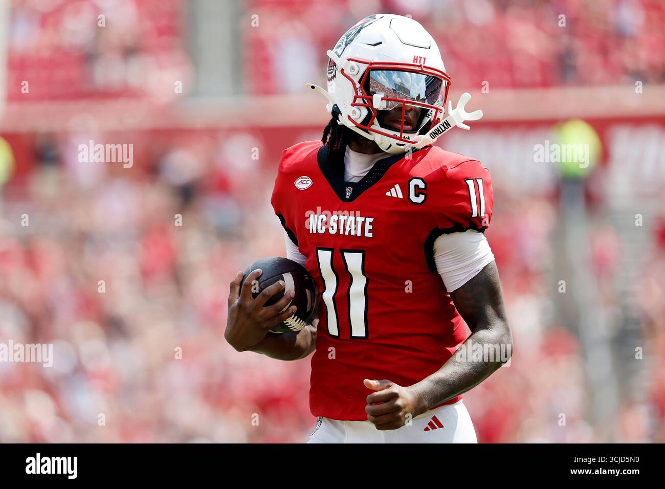 North Carolina State quarterback CJ Bailey (11) scores a touchdown ...