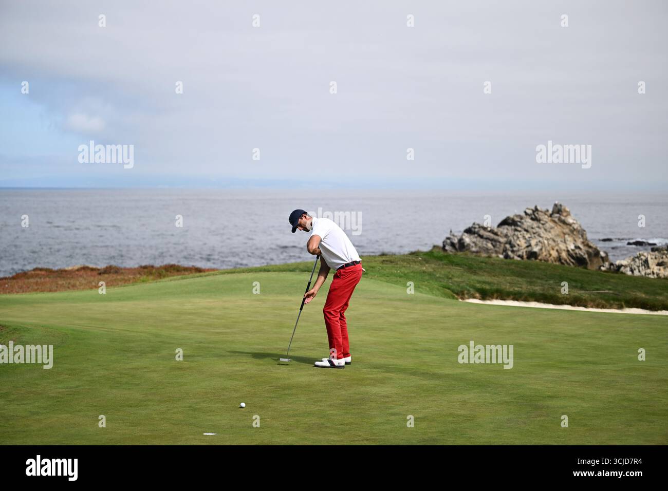 The USA team's Stewart Hagestad putts on the 15th green during Walker ...