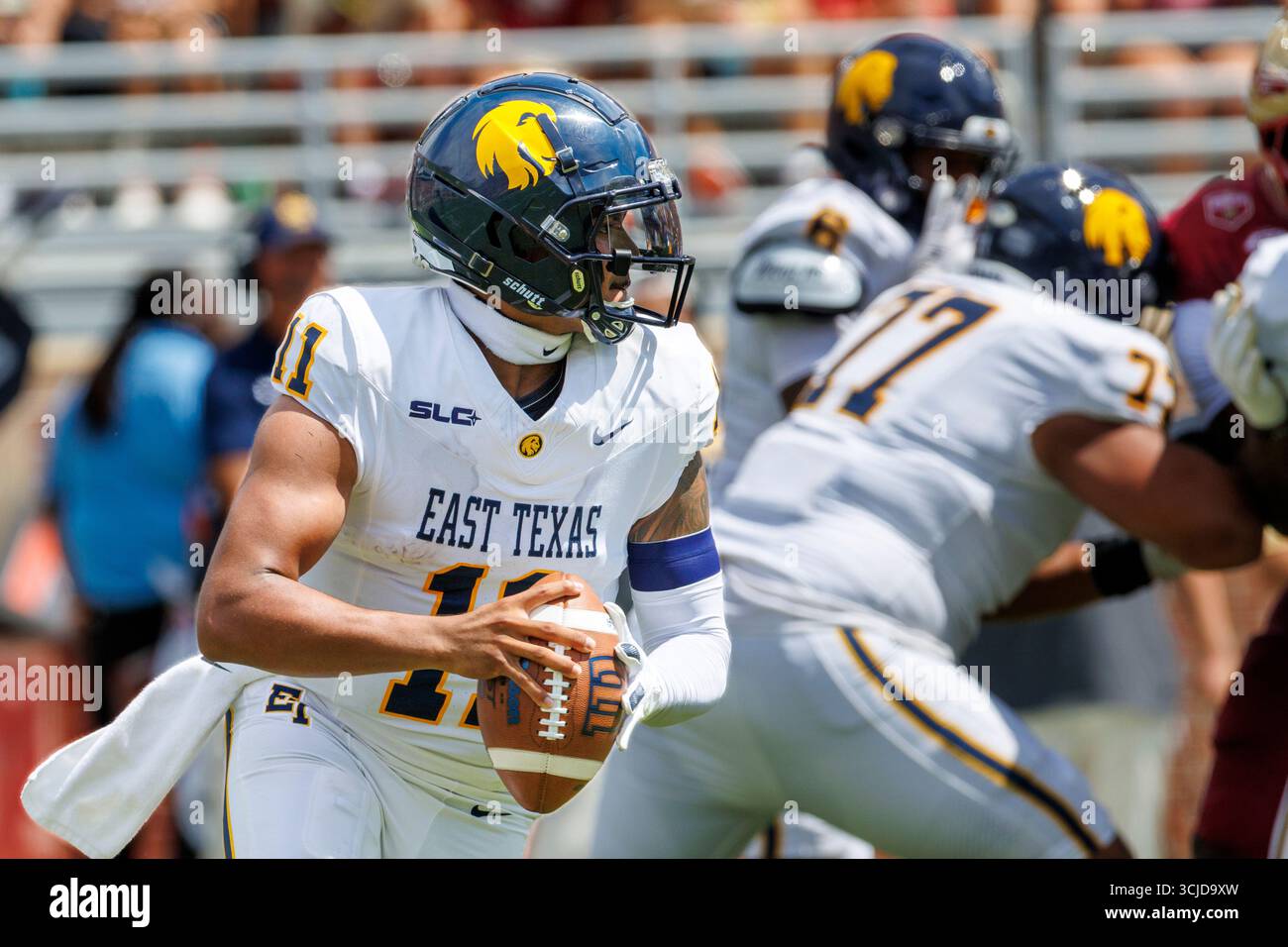 East Texas A&M quarterback Eric Rodriguez (11) looks for a receiver ...