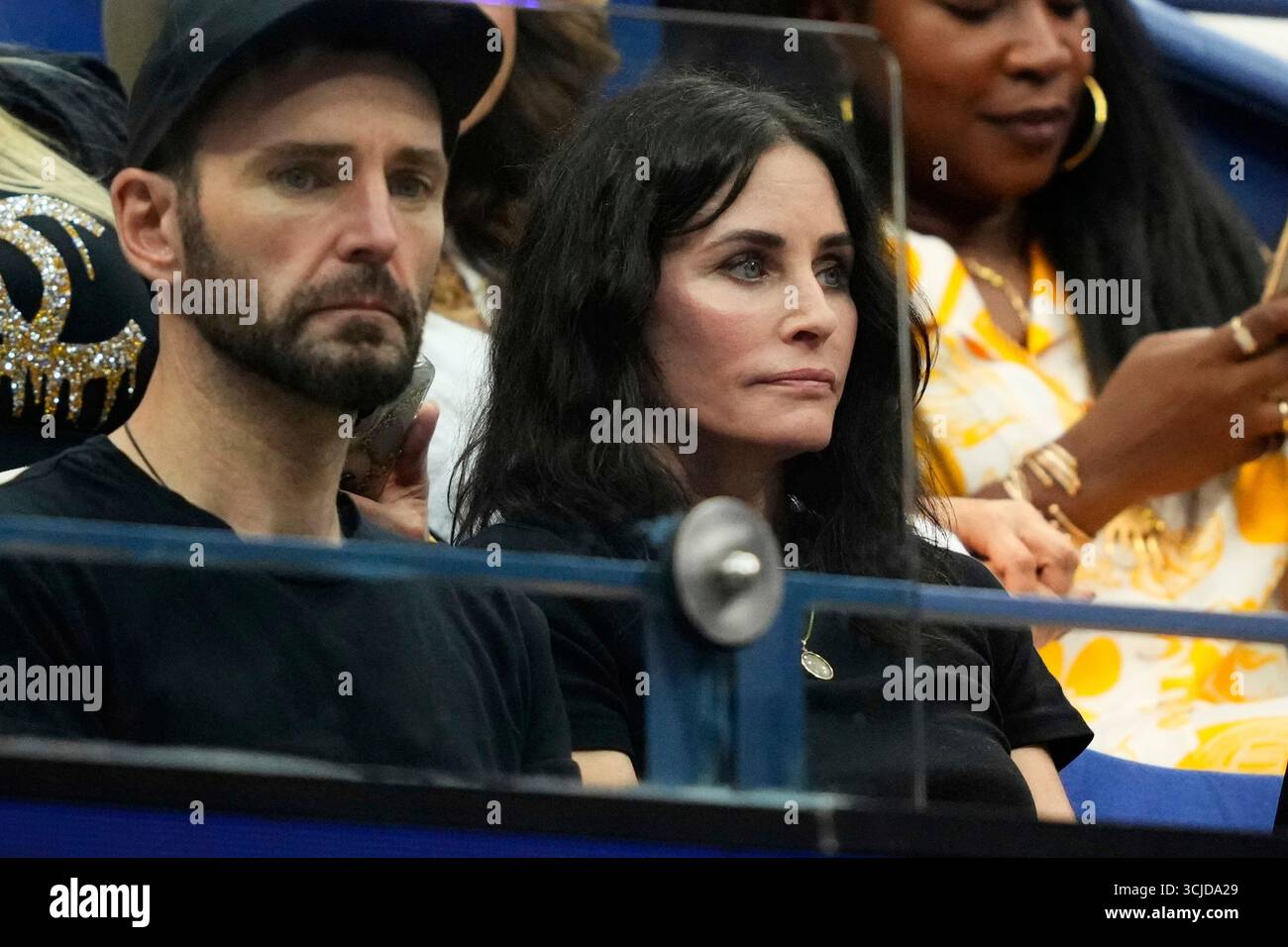 Courtney Cox watches during the women's finals of the U.S. Open tennis ...