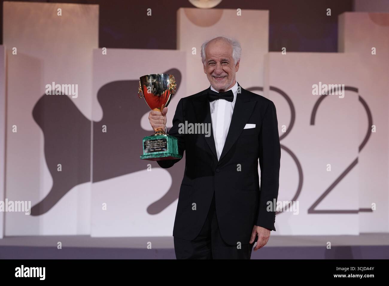 Toni Servillo poses with the Coppa Volpi for Best Actor for “La Grazia ...