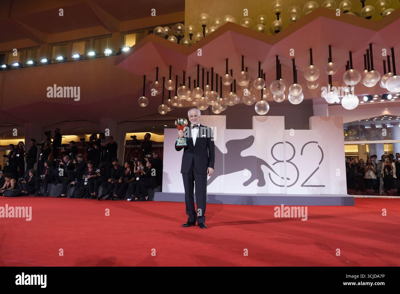 Toni Servillo poses with the Coppa Volpi for Best Actor for “La Grazia ...