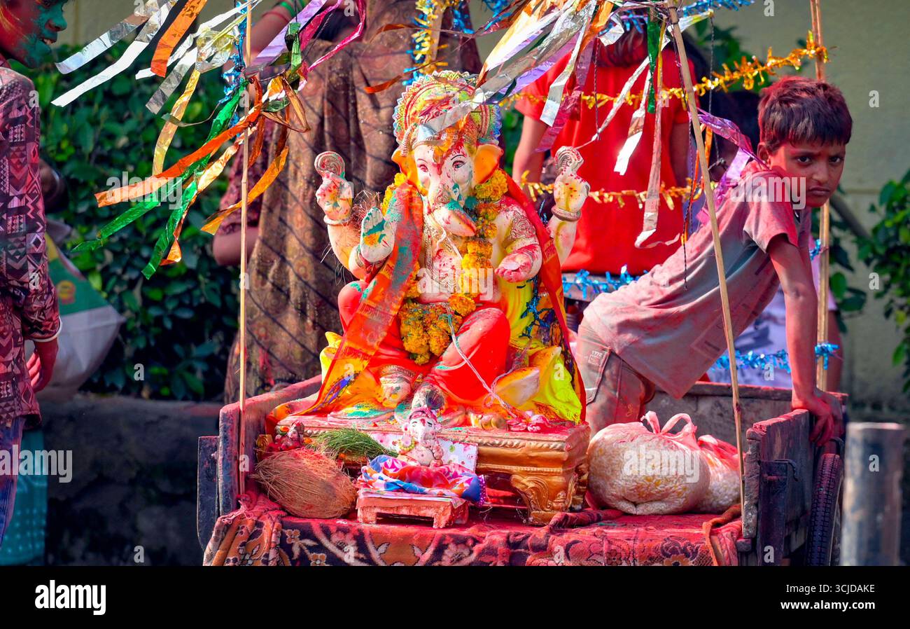 NEW DELHI, INDIA - SEPTEMBER 6: Devotees immersed the idol of Shree ...
